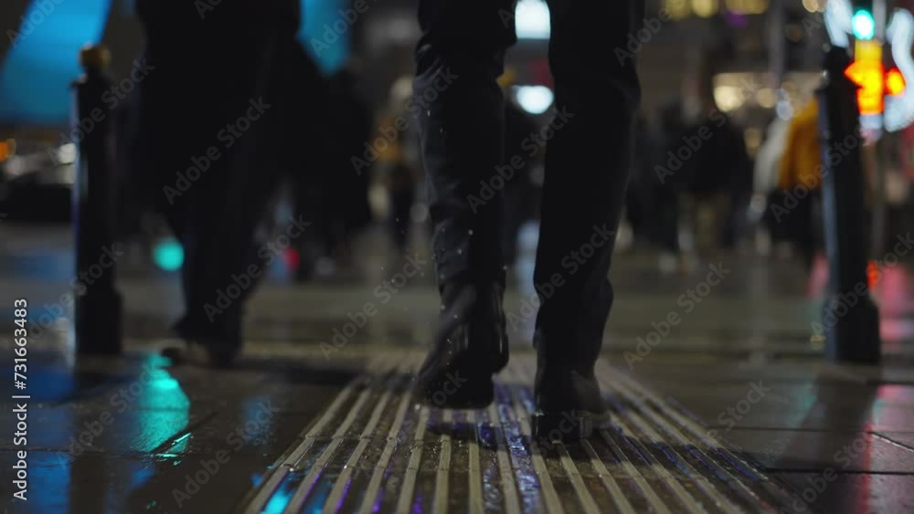 Rear back view male feet steps crossing busy street at night. Man ...