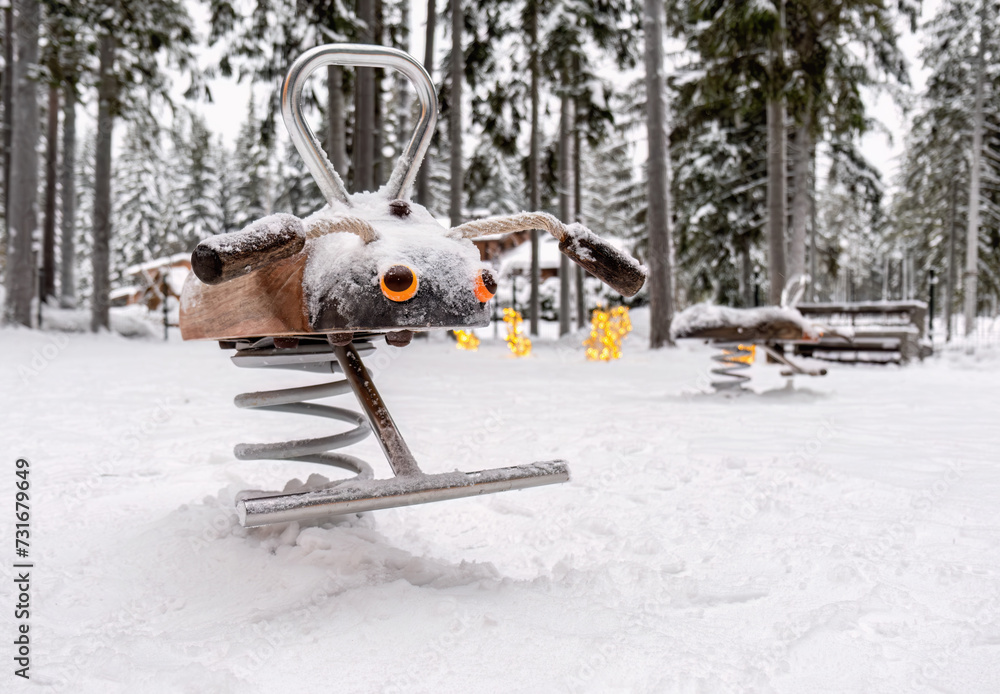 Outdoor rocking chair on a spring for children's playgrounds in winter ...