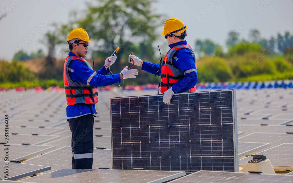 Technicians check floating solar farm wiring, polarity, and grounding ...