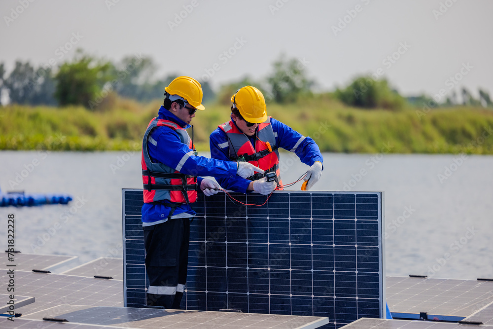 Technicians check floating solar farm wiring, polarity, and grounding ...