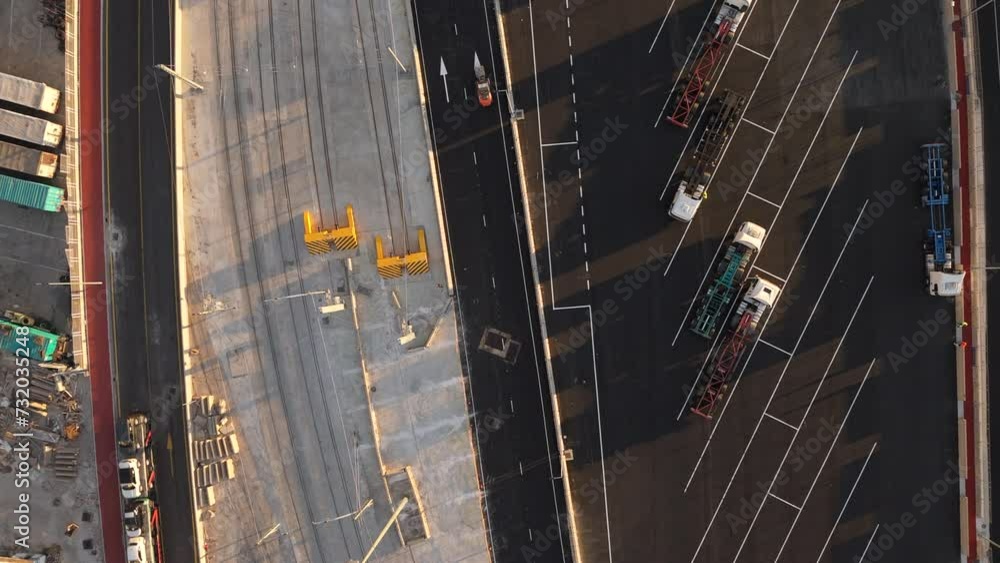 Top down aerial view of a congested cargo terminal road, railway and ...
