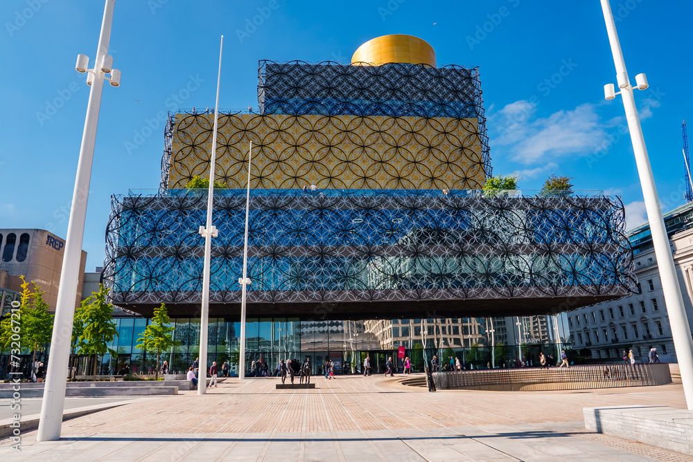 A sunny day showcases the Library of Birmingham, UK, with its patterned ...