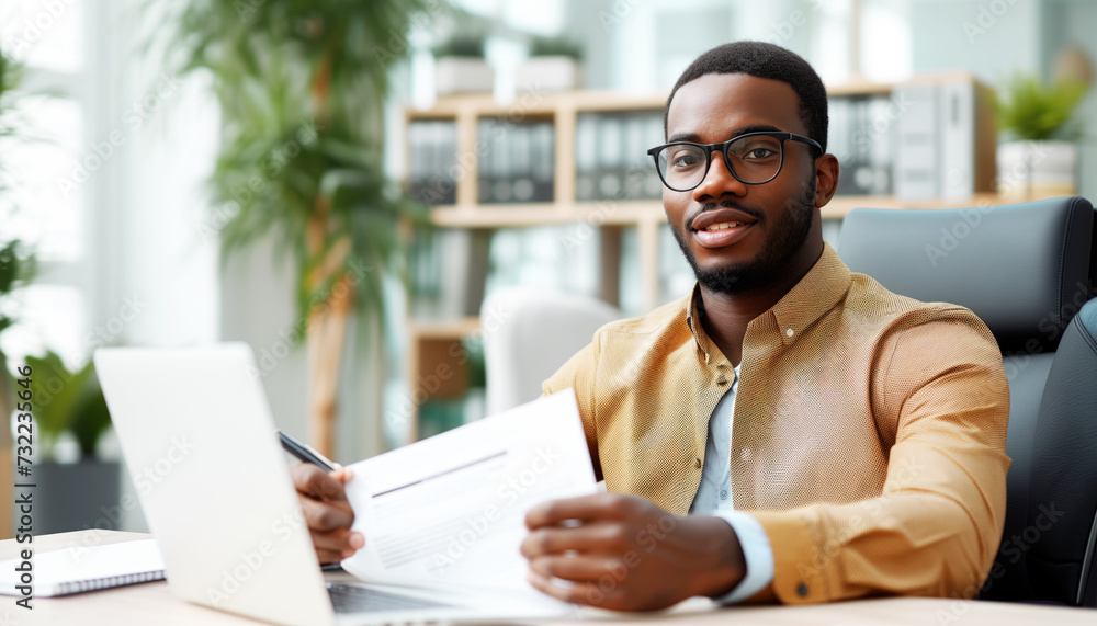 The recruiter holds the candidate's resume in his hands and conducts an ...