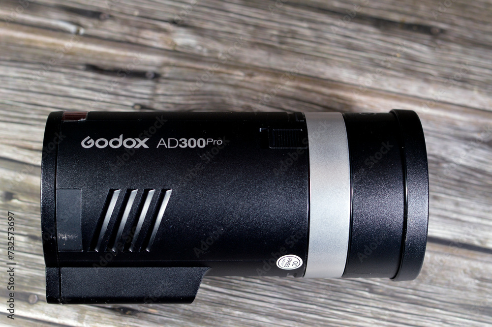Cairo, Egypt, February 9 2024: A portable Godox AD300 Pro outdoor flash head, a great asset on ...