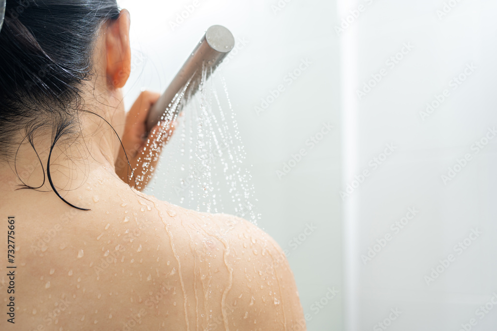 Female in shower rinse shampoo with water dripping on body. Young woman ...