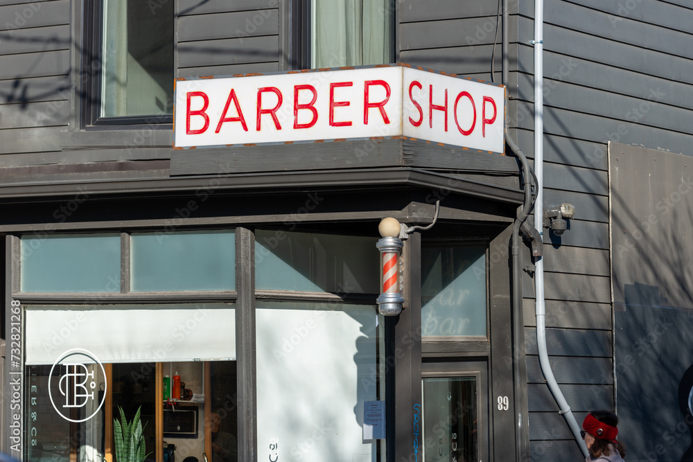 exterior building facade windows entrance sign and barber pole of ...