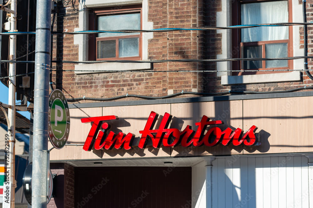 exterior building facade and sign of Tim Hortons, a fast food ...