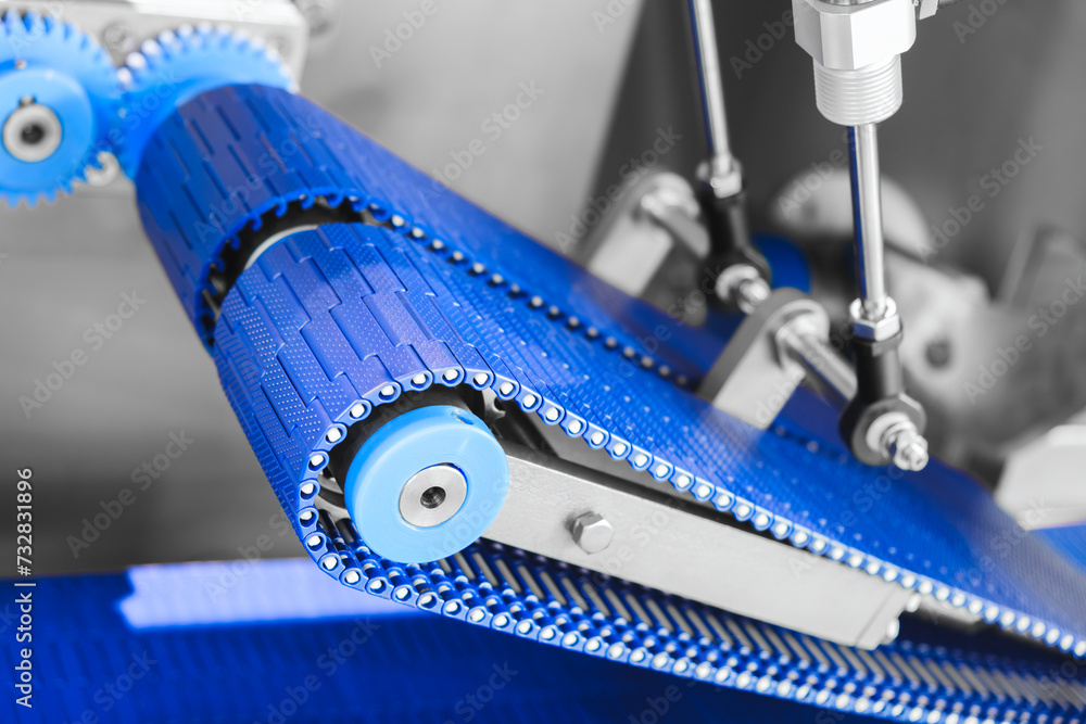 Gear chain drive shaft in conveyor belt is on production line. Timing ...