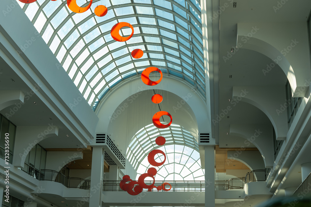 glancing up at the mobile sculpture installation and barrel vaulted ...