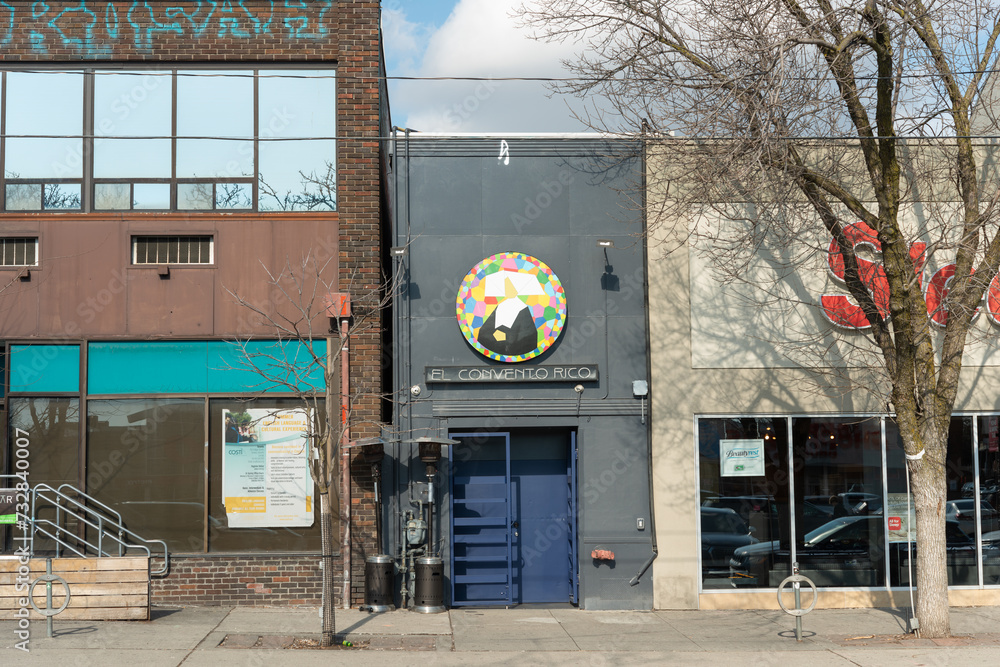 exterior building entrance and sign of El Convento Rico, a nigh club ...