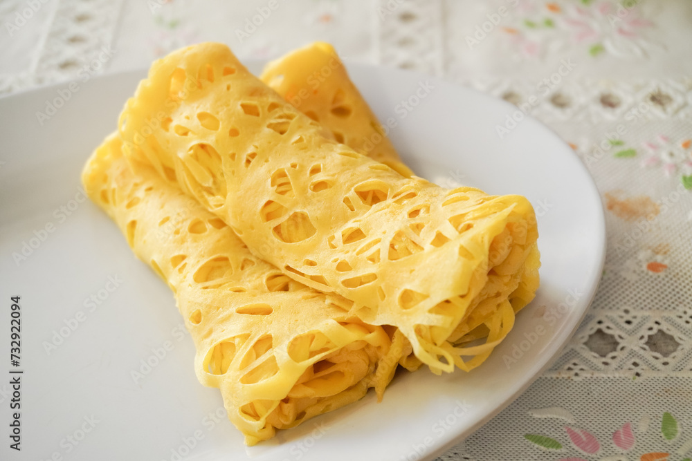 Roti jala is a typical Malay food in North Sumatra and served with ...