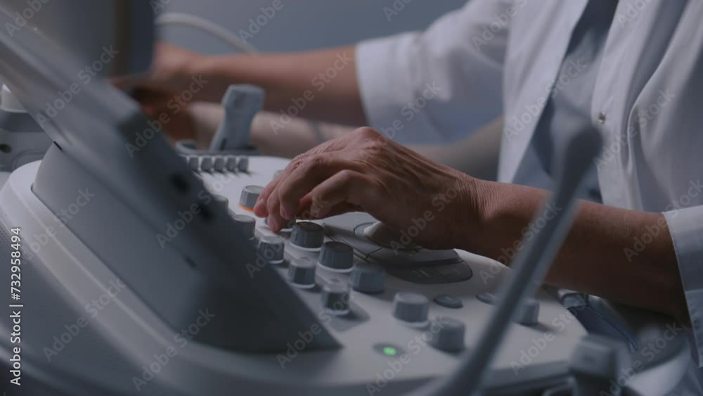 Close up of doctor using ultrasound machine. Professional medic does ...
