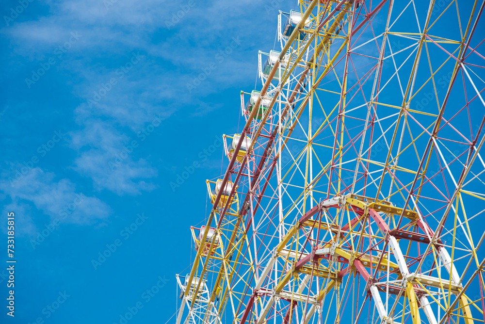 Close-up upward view the support frame of modern colorful Ferris Wheel ...