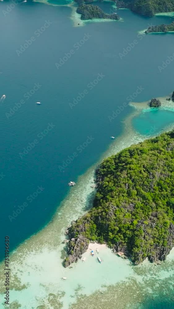 Banul Beach with group of boats. Corals and Lagoons in Coron, Palawan ...