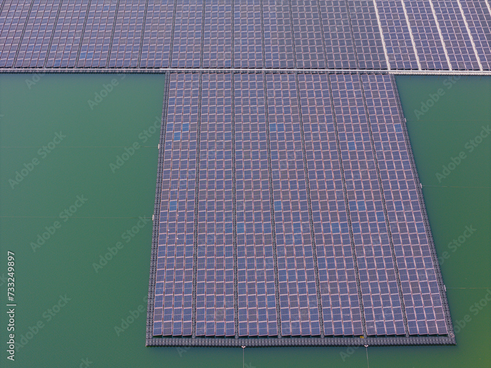 Power panels for green energy. Floating solar panels or solar cell Platform system on the lake ...