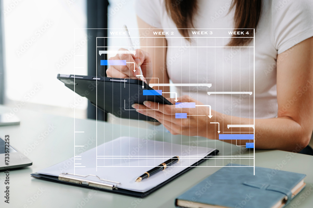 Project manager working and update tasks with milestones progress ...