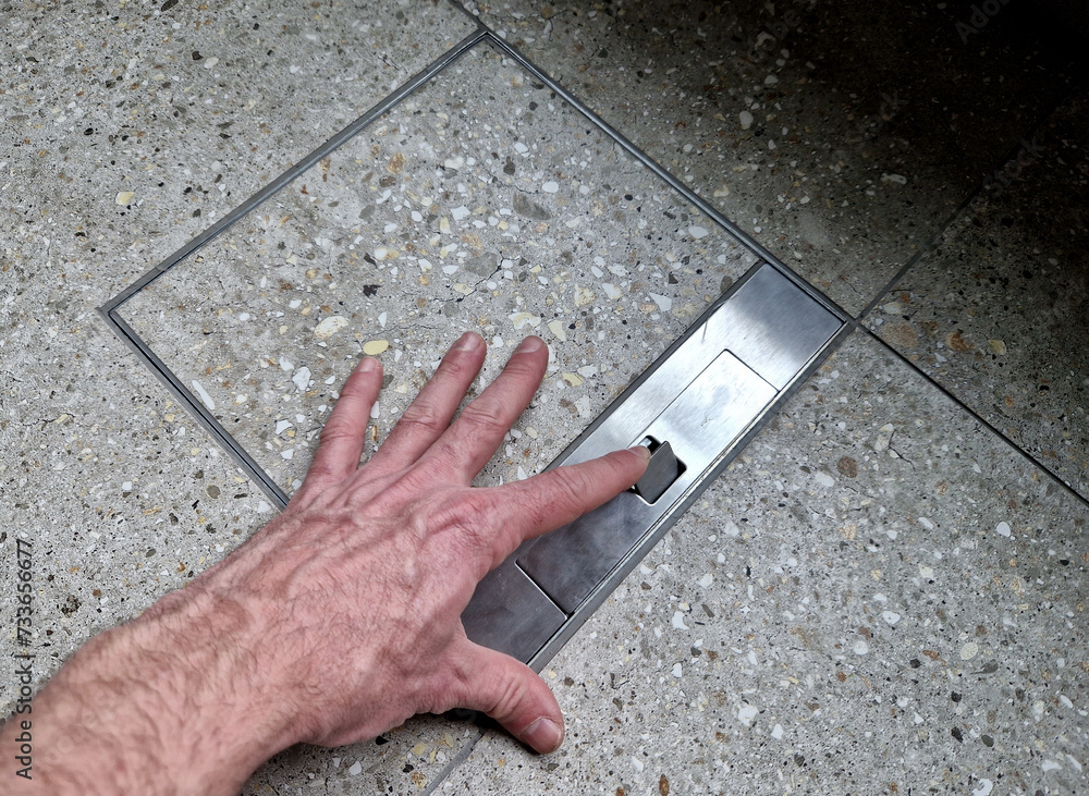 hatch in the floor hides the slots for connecting to the mains and ...