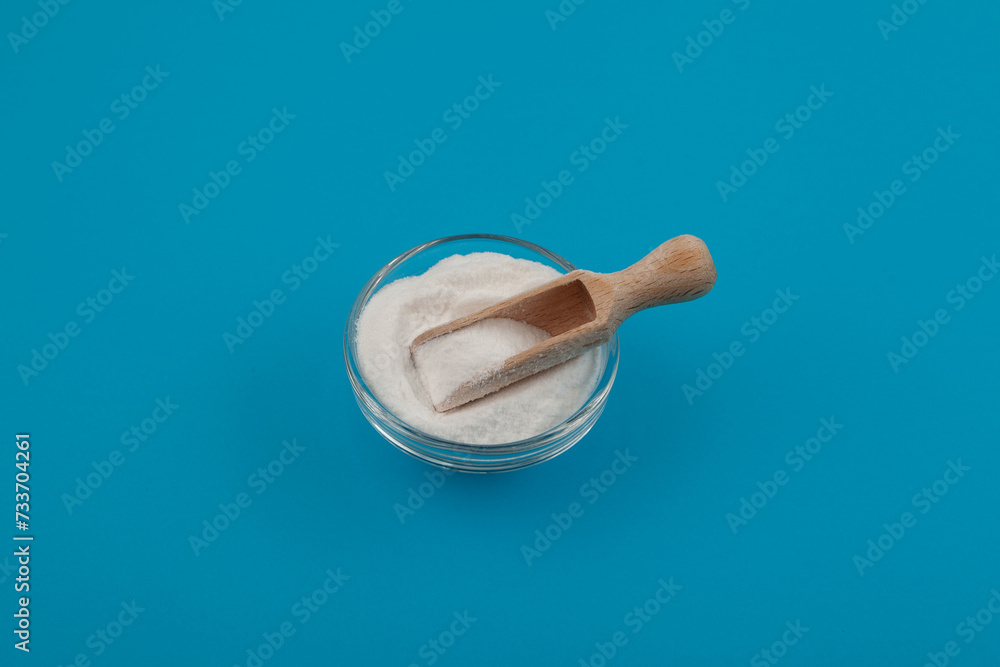 Succinic acid powder on blue background. Butanedioic acid or spirit of ...