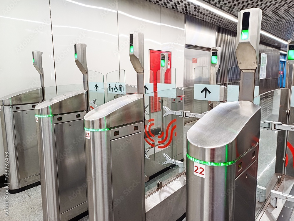Modern automatic turnstiles made of stainless steel close-up inside a ...