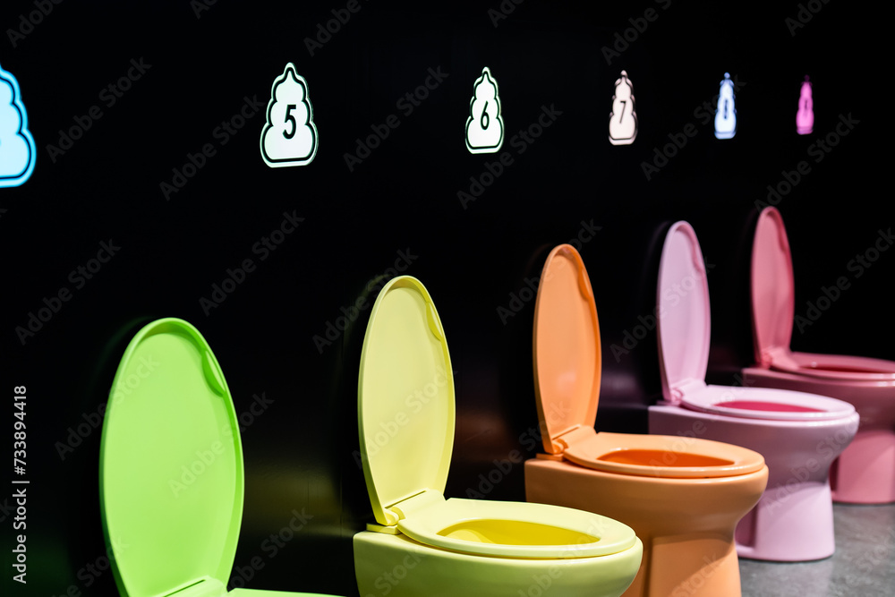 Eye-catching display of modern toilets in a spectrum of vibrant colors ...