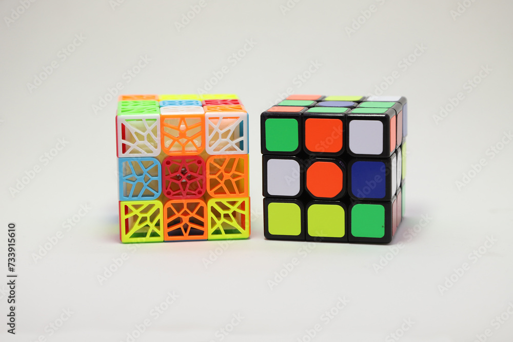 Two Rubik's cubes on isolated white background. Traditional rubik cube ...