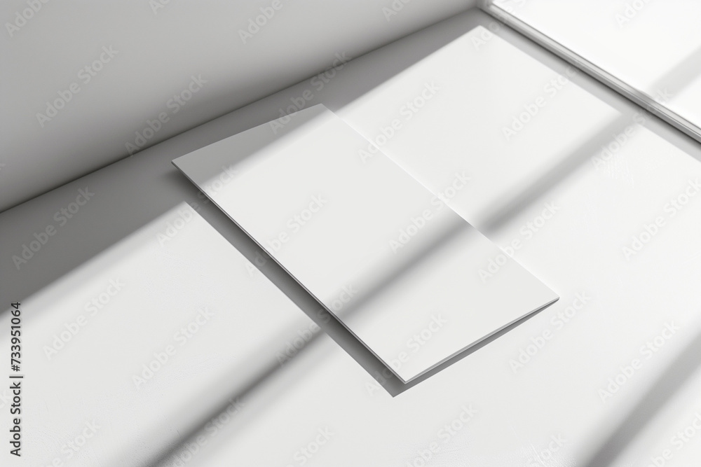 Clean and simple leaflet mockup lying flat on a smooth, white surface ...