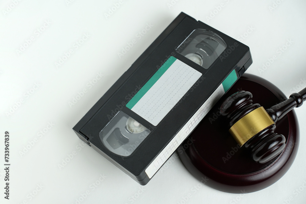 Video copyright law concept. VHS cassette tape and judge gavel Stock ...