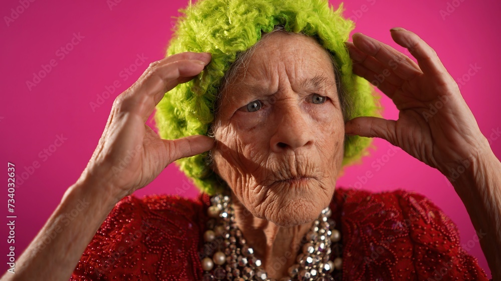 Funny elderly senior old woman with no teeth and wrinkled skin gives ...