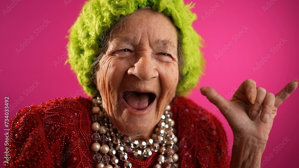 Fisheye view of funny elderly mature woman, 80s, wearing green wig ...