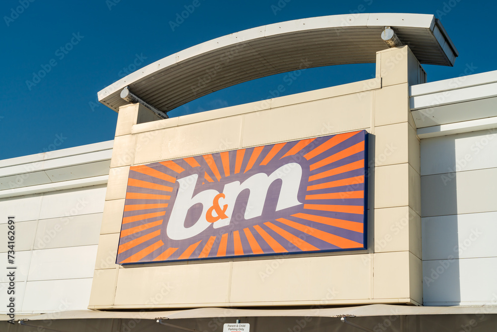 Wolverhampton, England – February 12 2024: UK Variety store, B&M signage at the Bentley Bridge ...