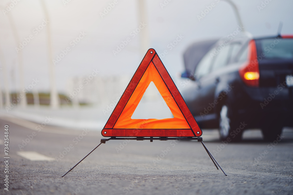Close-up view of emergency stop sign on asphalt road, blurred ...