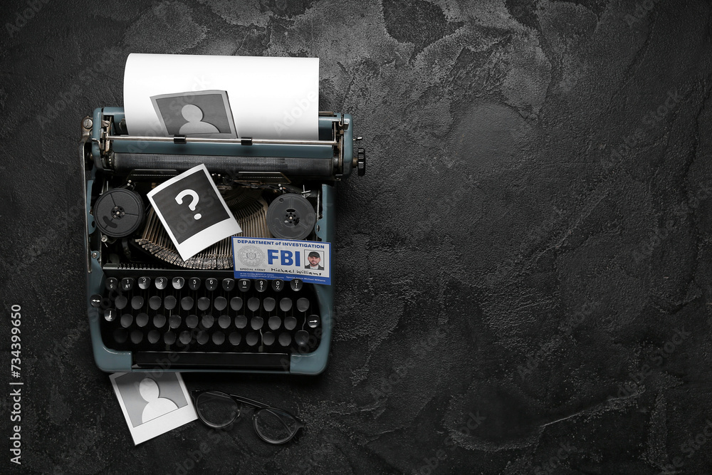 Retro typewriter, document of FBI agent and question mark on dark ...