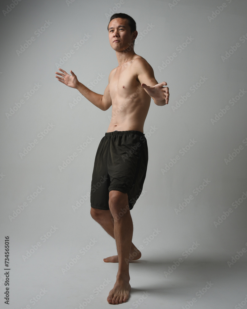 full length portrait of fit asian male model, shirtless with muscles ...