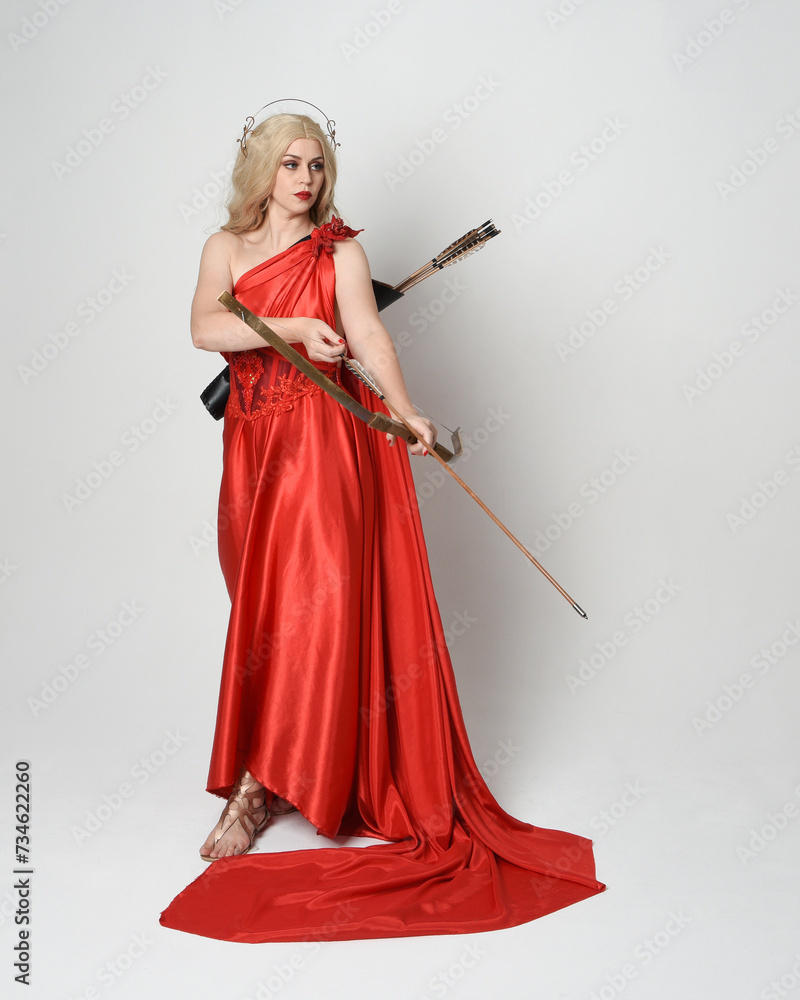 Full length portrait of blonde model dressed as mythological fantasy ...
