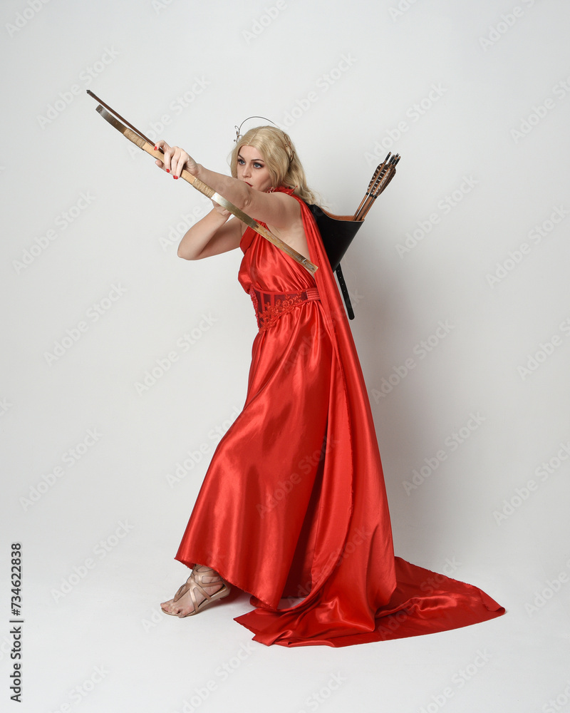 Full length portrait of blonde model dressed as mythological fantasy ...