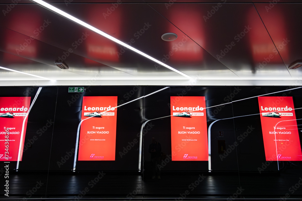 Rome, Italy Red signs in a pedestrian tunnel for the Leonardo Express ...