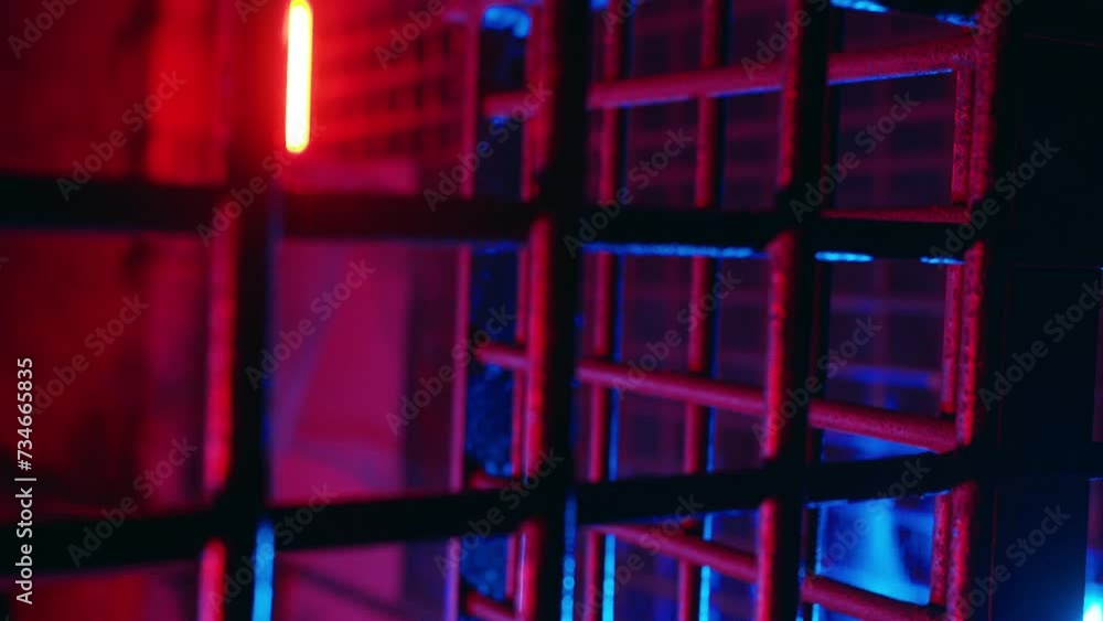 Thriller jail lit with ambient red and blue neon light. Cinematic metal ...
