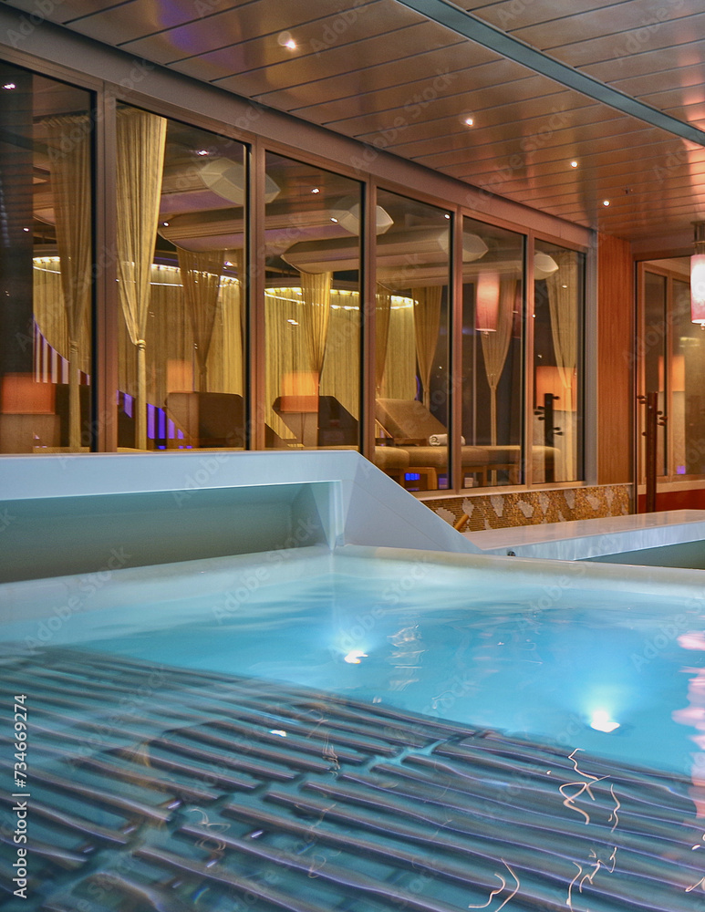 Indoor swimmingpool with hot tub whirlpool inside thermal suite in spa ...