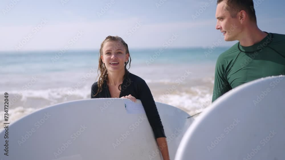 Romantic surfers couple in love go out of ocean waves satisfied with ...