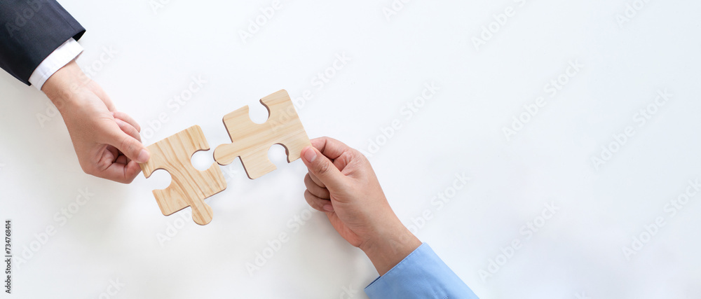 Foto de Teamwork and partnership Concept. Two hands trying to connect ...