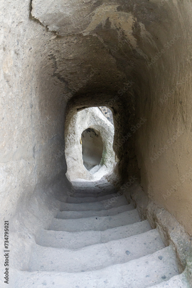 Stone staircase inside a cave. Vardzia is a cave monastery, an ancient ...