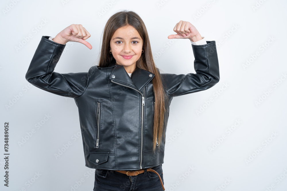 Strong powerful Young beautiful teen girl wearing biker jacket toothy ...