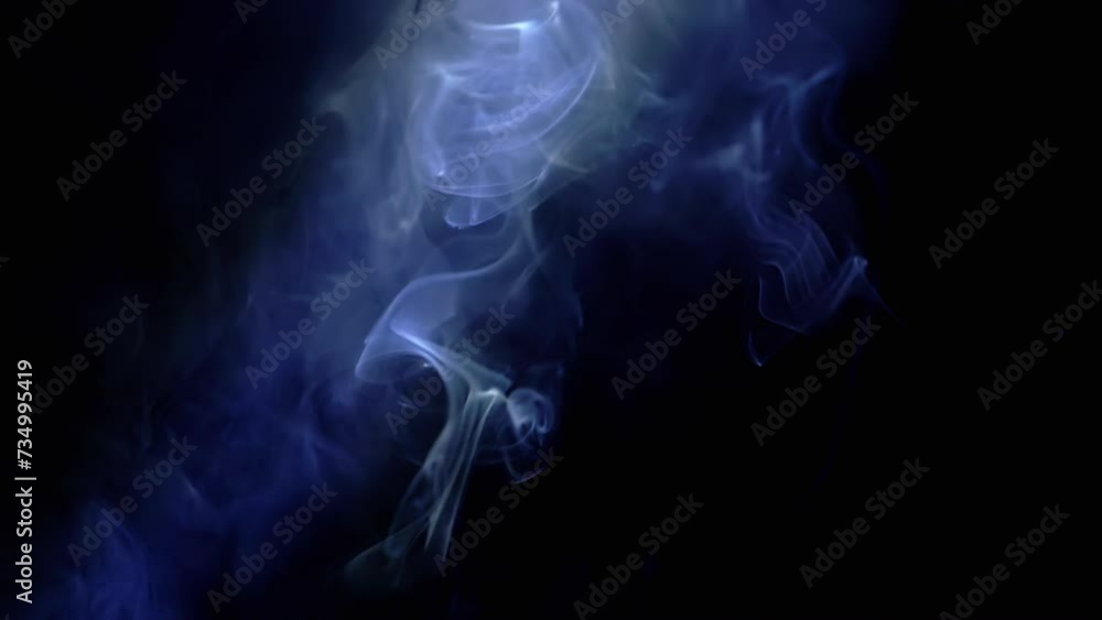 Vidéo Stock Thick Curls of Icy Blue Smoke Rise Up in Rays of Neon Light ...