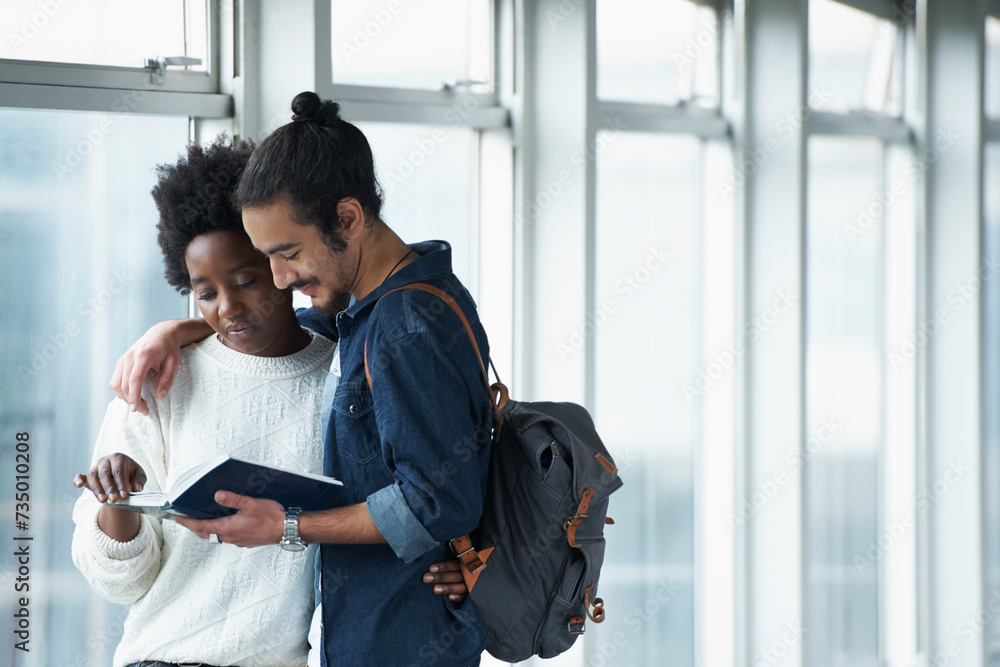 Couple, university and students with a book, hug and conversation for ...