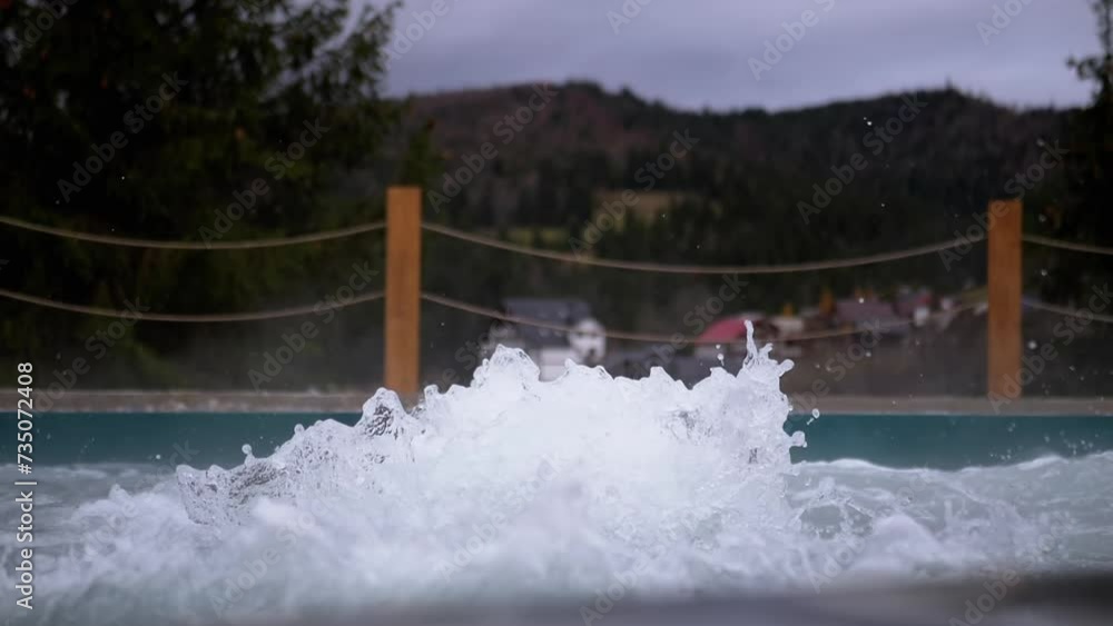 Empty Boiling Tub with Hot Water from thermal springs outdoors. Splash ...