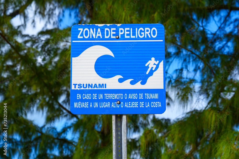 Tsunami warning sign in Spanish on the beach in Puerto Rico Stock Photo ...
