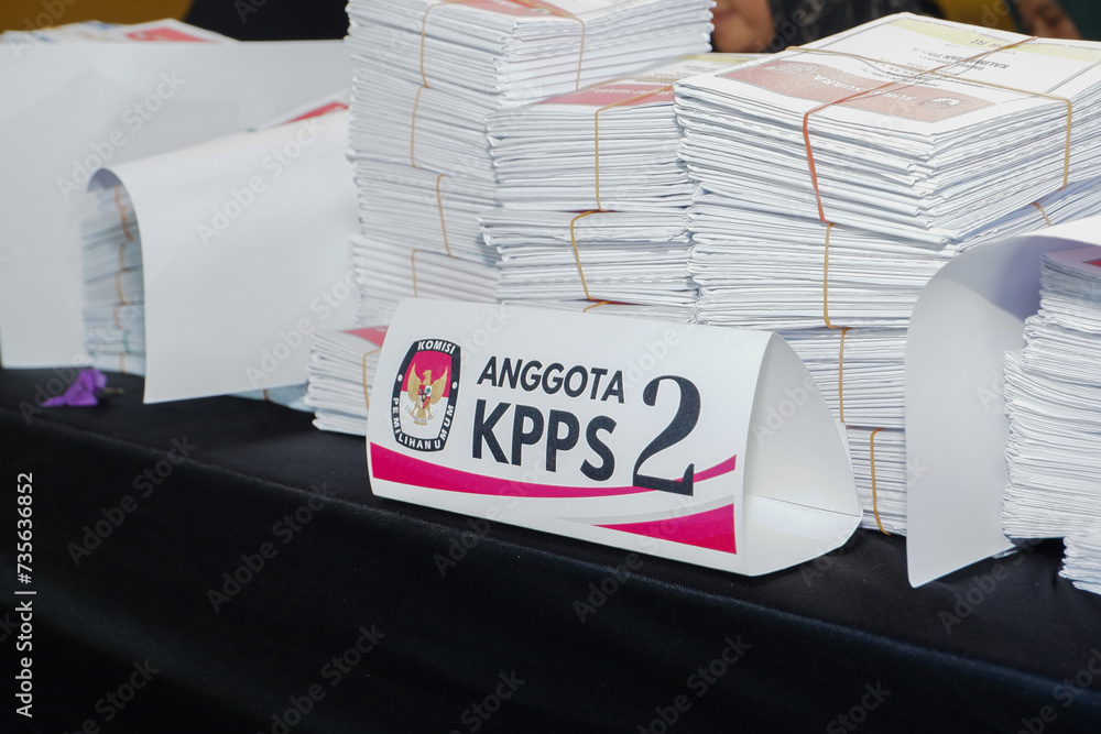name plate for KPPS members at the polling station with a pile of ...