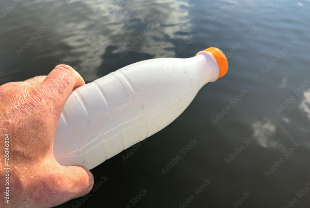 Marine plastic pollution from human. Hand throwing plastic garbage in ...