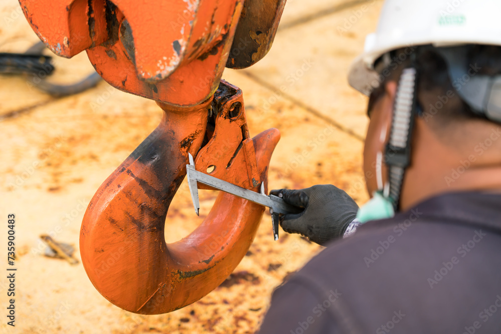 Mechanical engineer inspector is inspecting lifting equipment of ...