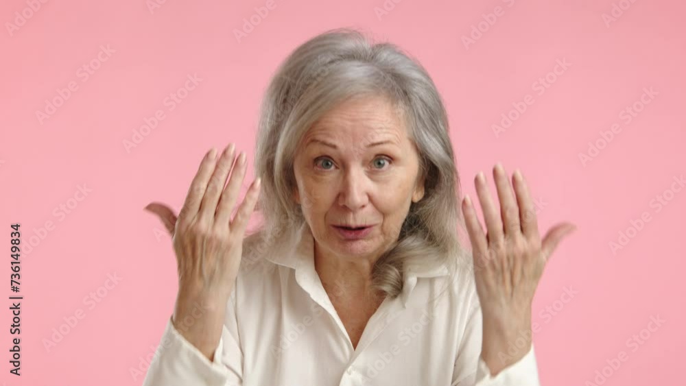 An elderly woman's face conveys strong disapproval and dissatisfaction ...